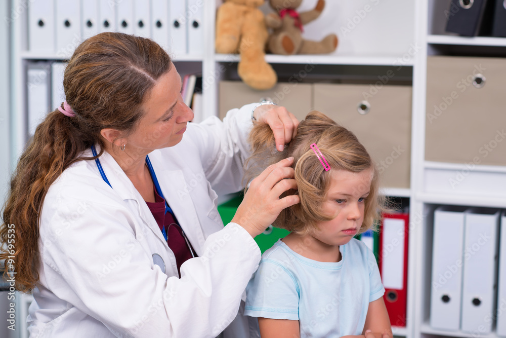 female pediatrician in white lab coat examined little patient Stock ...