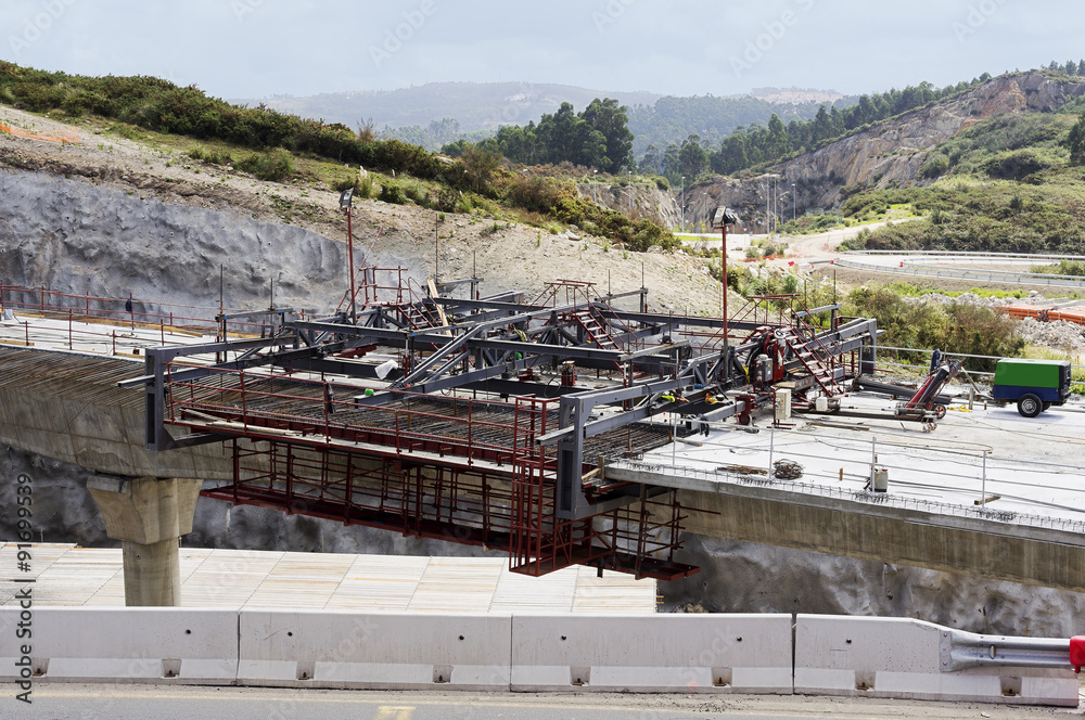 workers in construction site working in the bridge girders between the ...