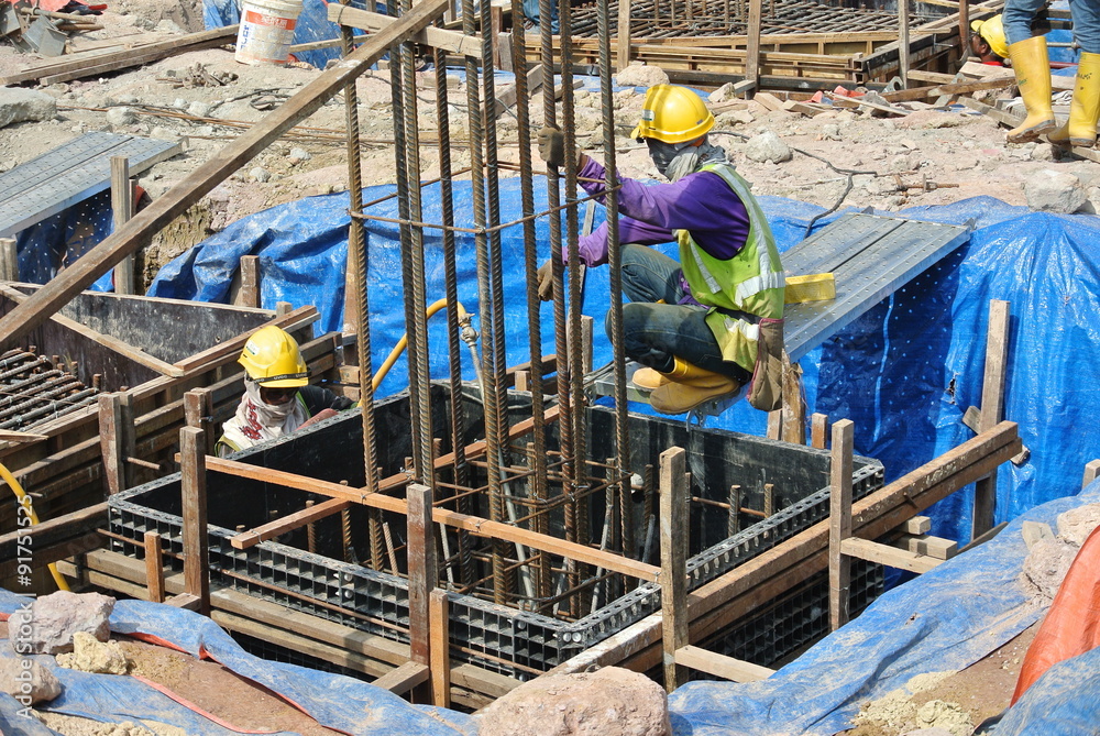 Construction workers installing pile cap formwork Stock Photo | Adobe Stock