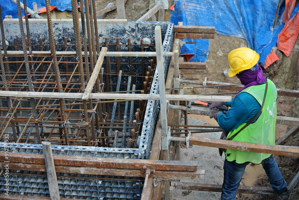 Construction workers installing pile cap formwork Stock Photo | Adobe Stock