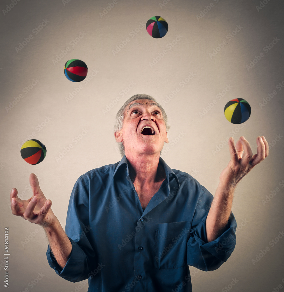 Man juggling with little balls Stock Photo | Adobe Stock