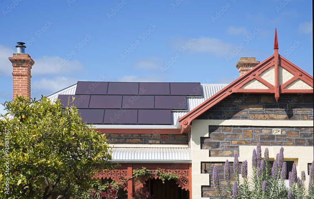 Solar panels on old heritage house Stock Photo | Adobe Stock