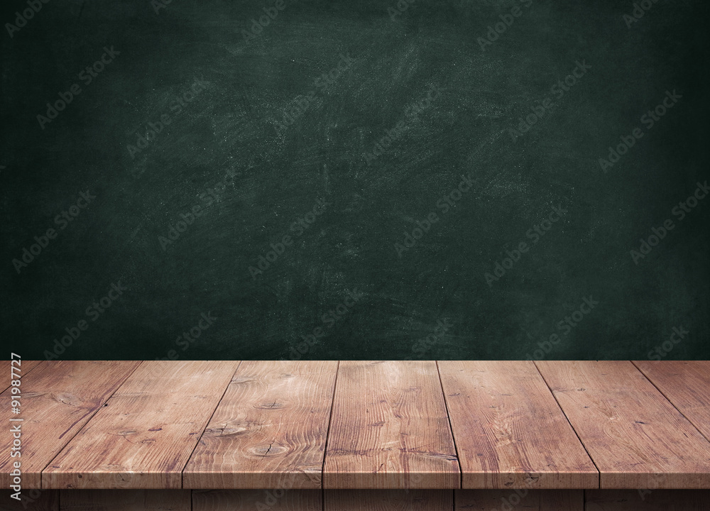 Wood table with blackboard background Stock Photo | Adobe Stock