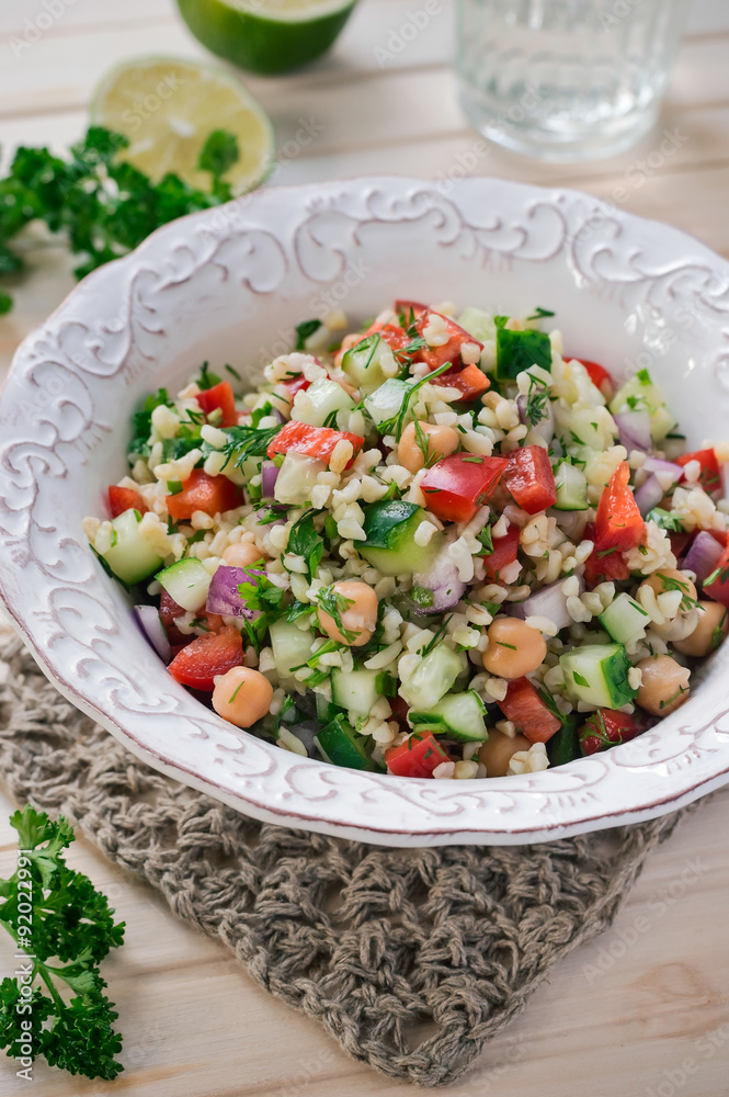 Arabic-style salad of bulgur with vegetables Stock Photo | Adobe Stock