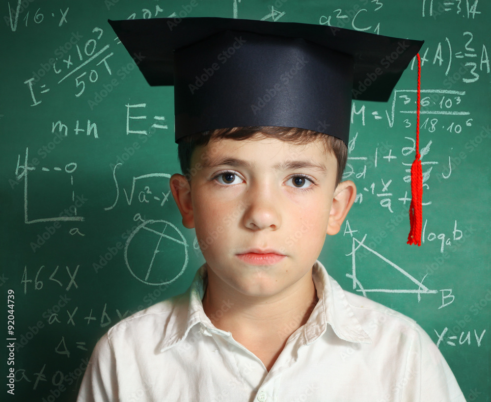 boy in graduation cap blackboard background Stock Photo | Adobe Stock