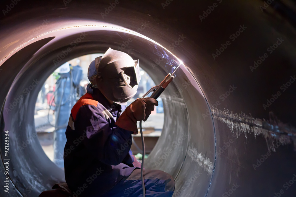 welder weld root weld from inside of big pipe Stock Photo | Adobe Stock