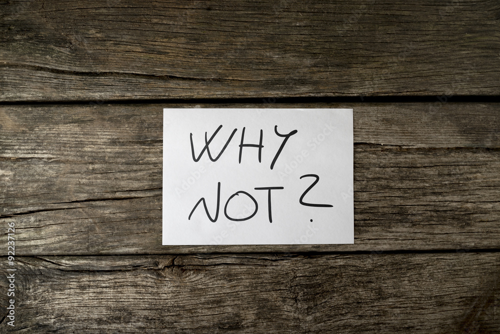 Overhead view of white card with Why not sign lying on a texture Stock ...