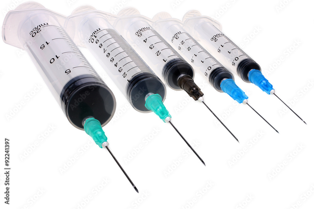 four new empty medical plastic disposable syringes isolated on white ...