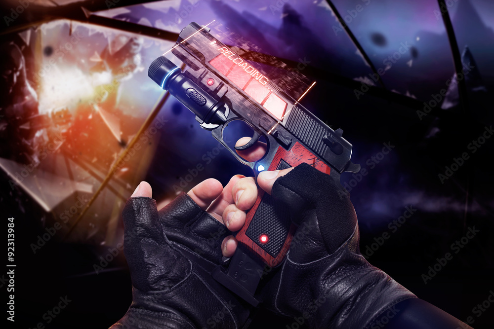Hand in black gloves holding a red neon recharging handgun. First ...
