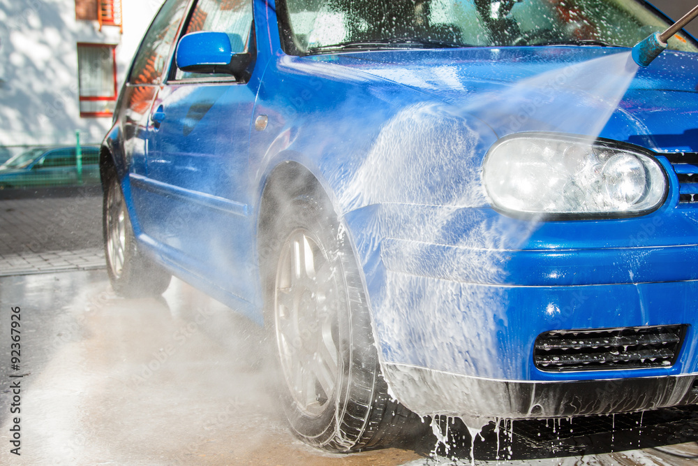 Blue car in a car wash Stock Photo | Adobe Stock