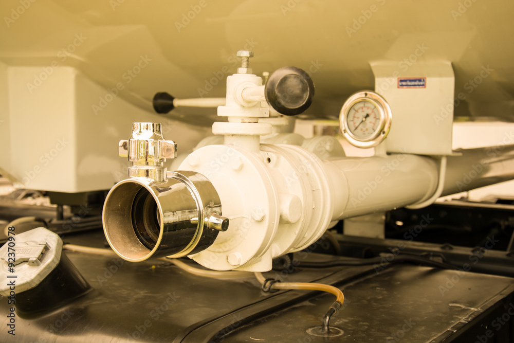 water valves at the rear of a fire engine. Stock Photo | Adobe Stock