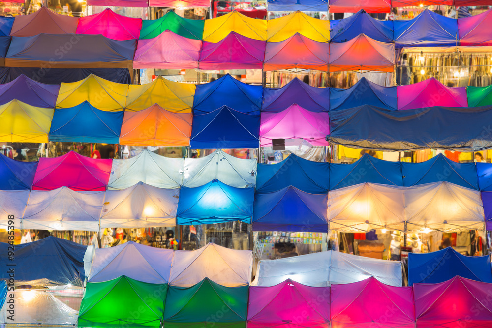 Aerial view of multiple colour of flea market roof top, background ...