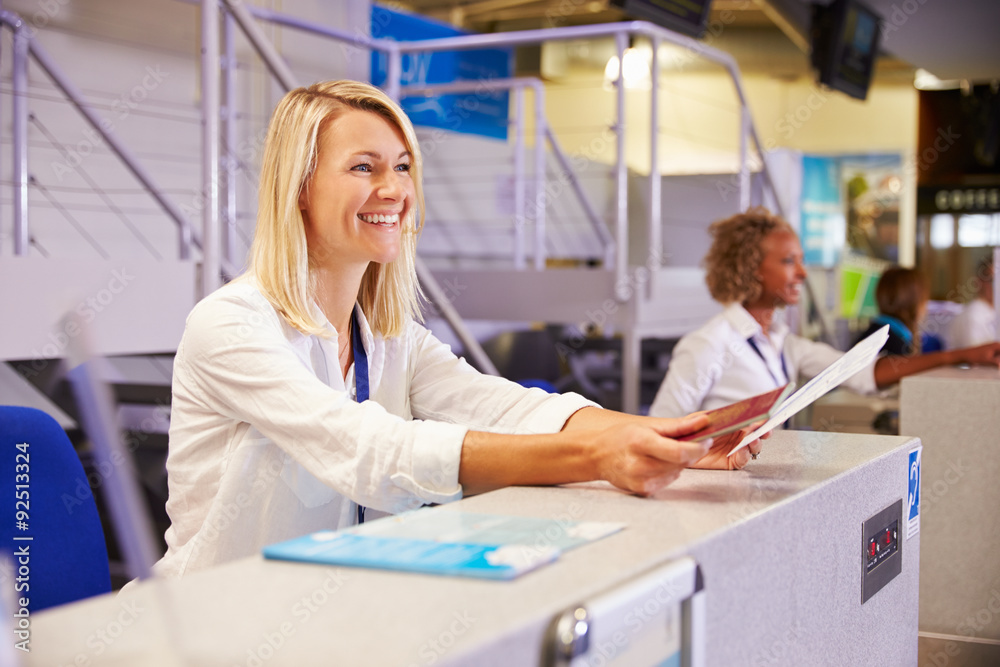 Staff Working At Airport Check In Desk Stock Photo | Adobe Stock