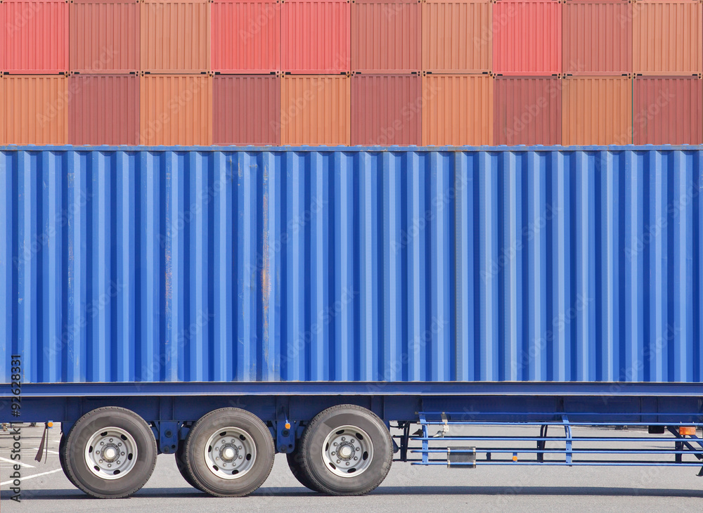 Container cargo truck and stack of container in background Stock Photo ...