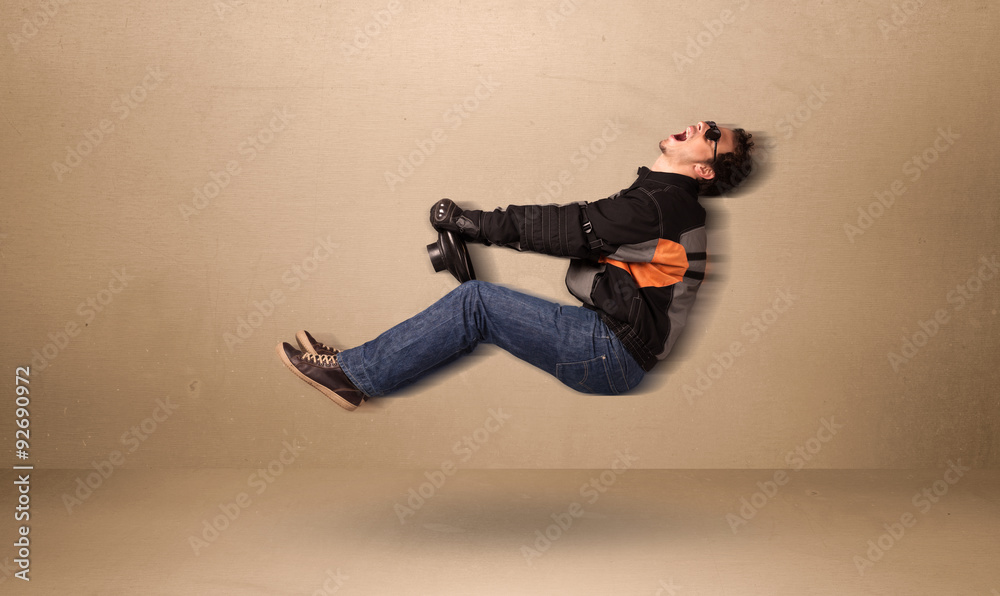 Happy funny man driving a flying car concept Stock Photo | Adobe Stock
