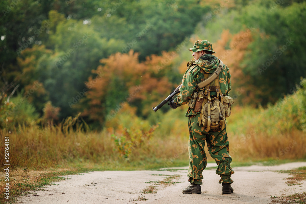 russian soldier in the battlefield with a rifle Stock Photo | Adobe Stock