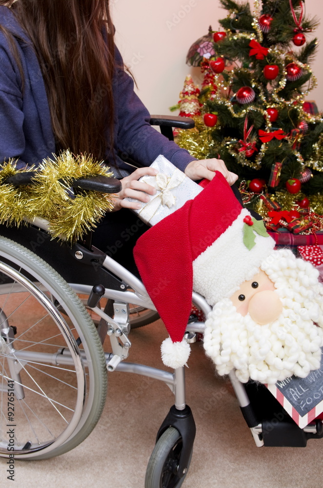Disabled Girl at Christmas Disabled girl in a wheelchair taking ...