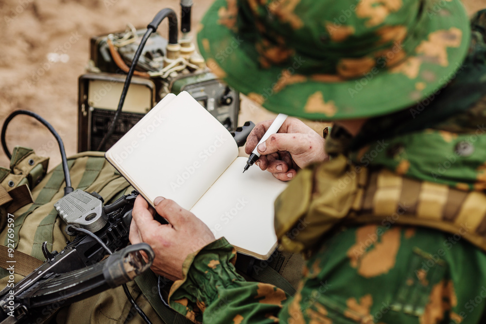 radio operator taking notes and radio Stock Photo | Adobe Stock