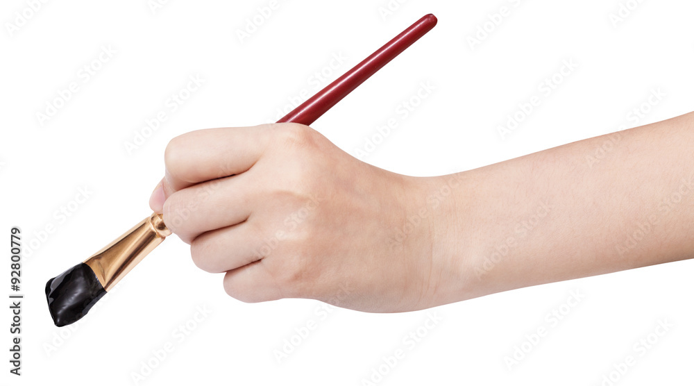 hand holds artistic flat paintbrush with black tip Stock Photo | Adobe ...