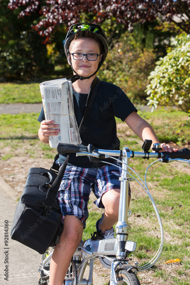 Newspaper Delivery Boy Stock Photo | Adobe Stock
