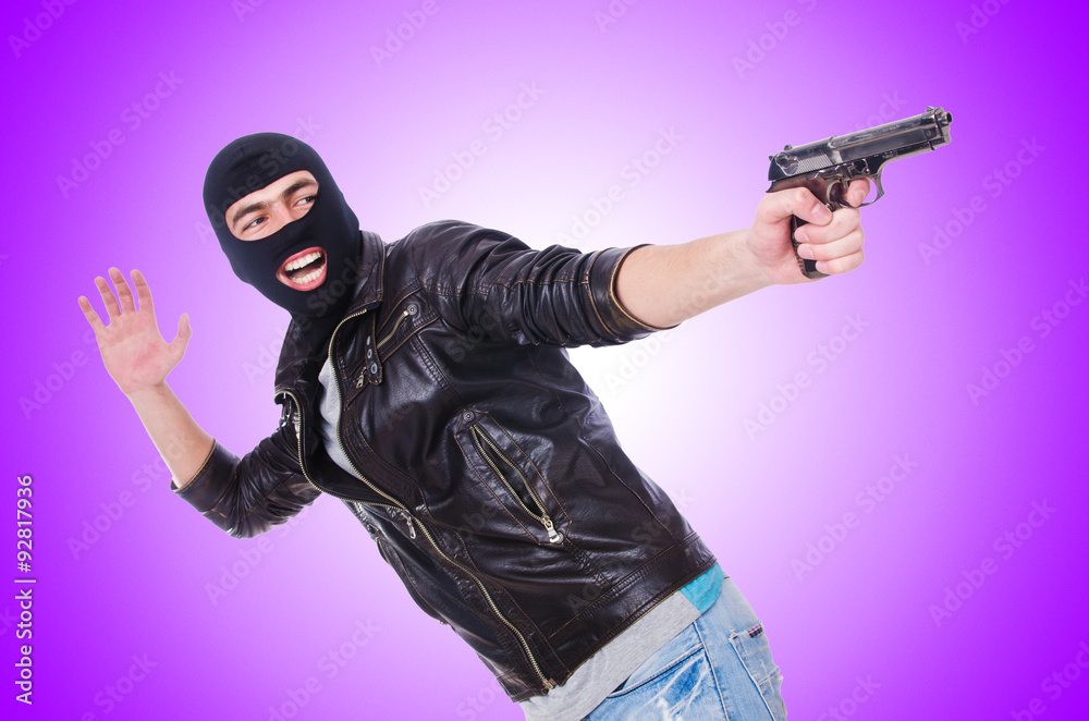 Young thug with gun isolated on white Stock Photo | Adobe Stock