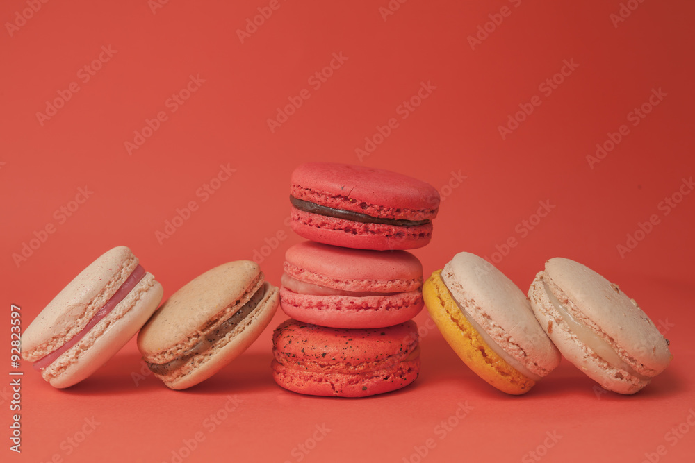Pile of colorful macaroons stacked up like a tower and macarons on ...