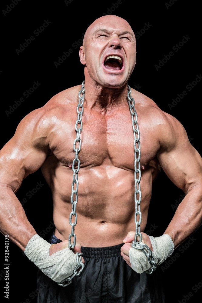 Muscular man shouting while flexing muscle Stock Photo | Adobe Stock