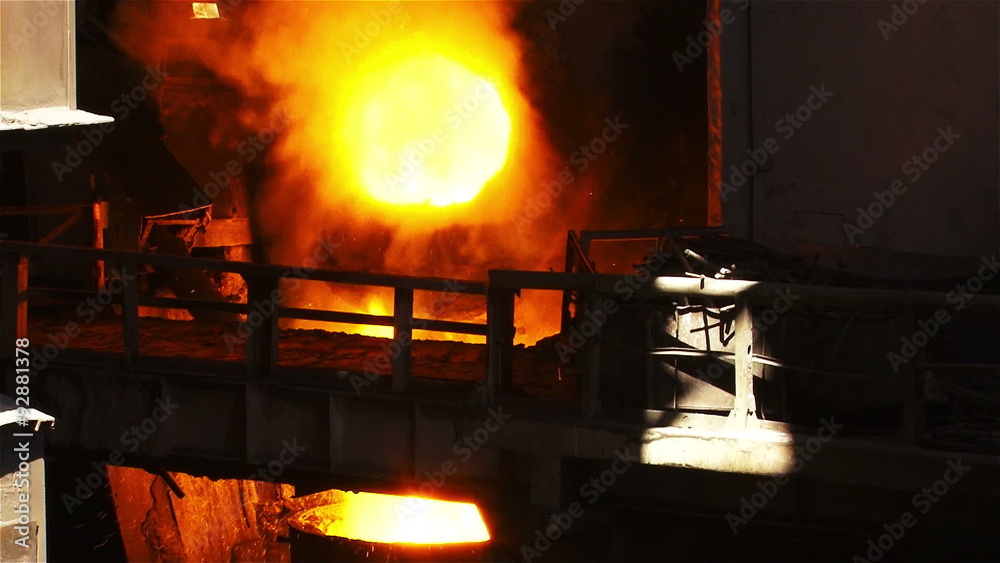 Two vat of liquid metal and fire shoots up Stock Video | Adobe Stock
