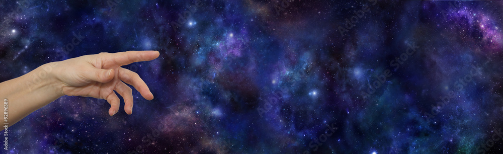 The Vastness of our Universe - female hand pointing out to the vast ...