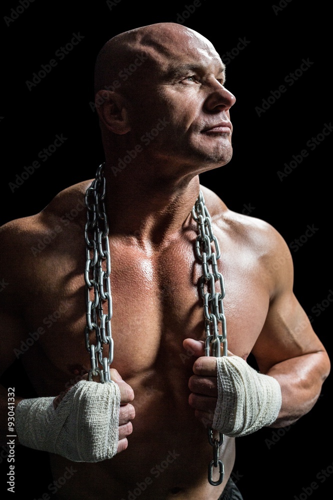 Muscular man holding chain Stock Photo | Adobe Stock