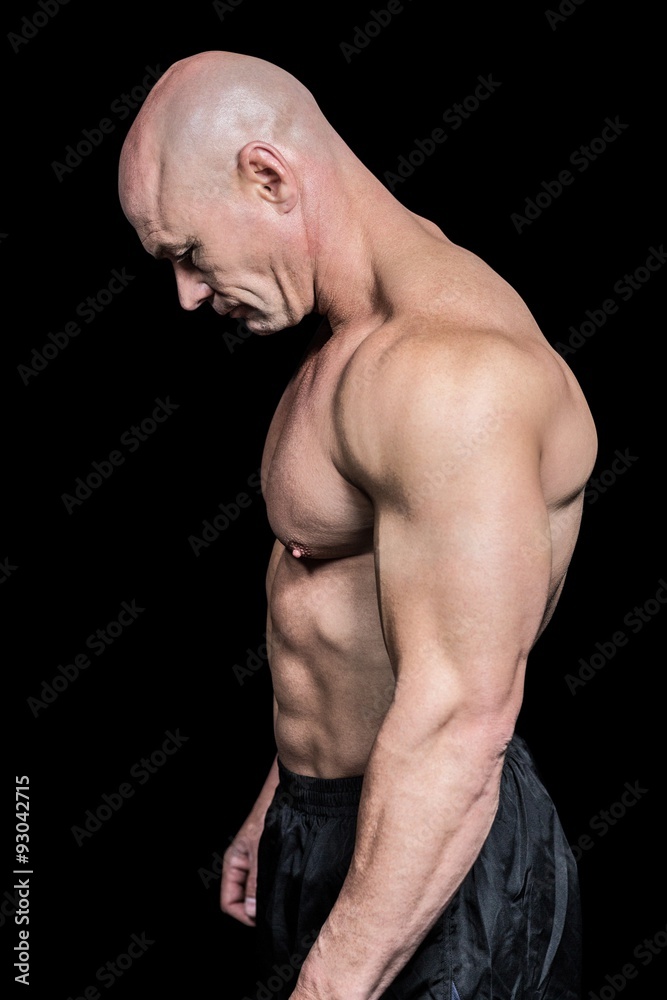 Side view of sad muscular man looking down Stock Photo | Adobe Stock