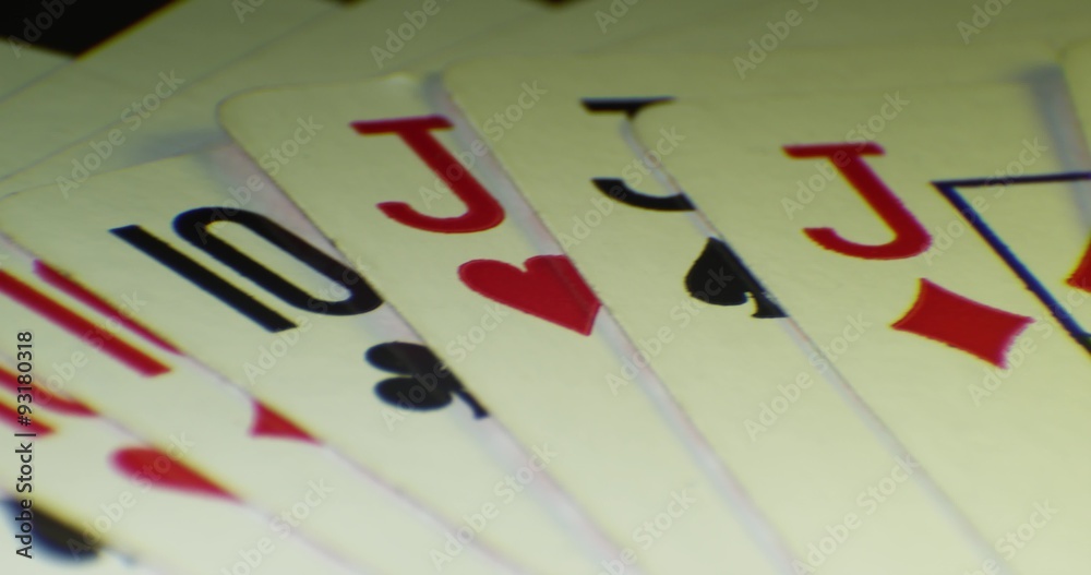 Various playing card background. Loop rotation on the table. Macro shot ...