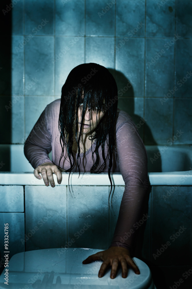 Scary woman in a bath coming out of the water all wet, Halloween and ...