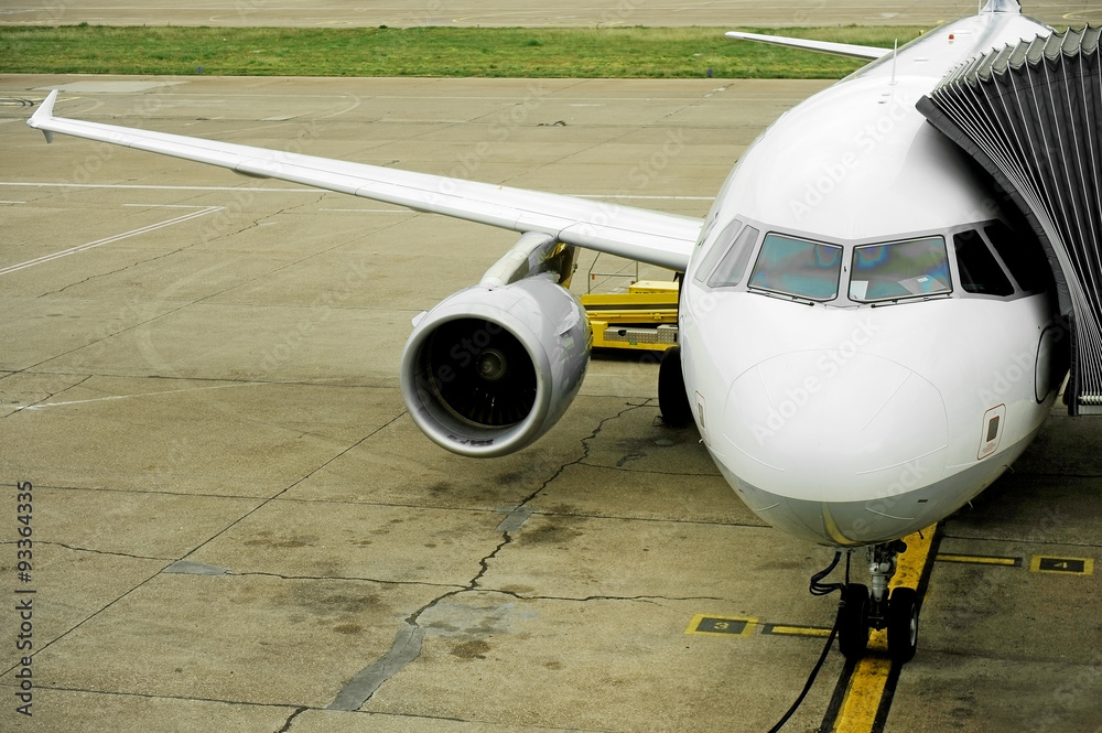 Airplane connected to jetway Stock Photo | Adobe Stock