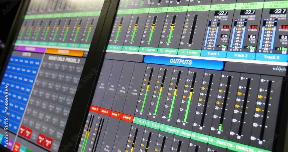 Side shot footage of an audio mixer and its screen, the audio output ...