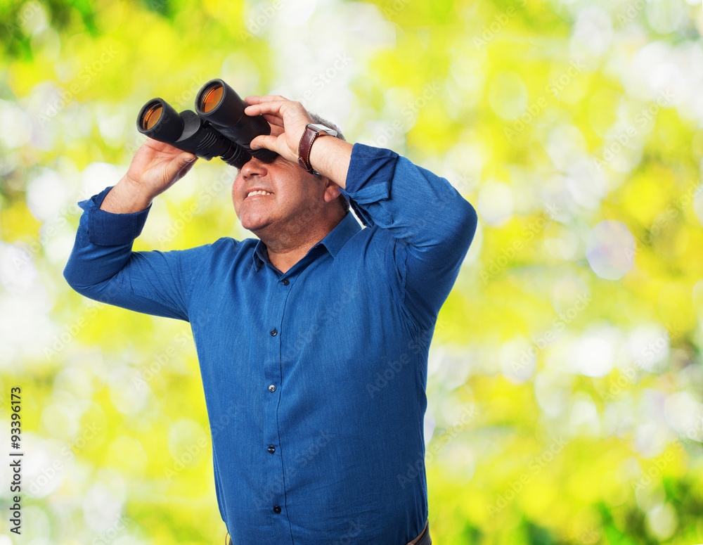man using binoculars Stock Photo | Adobe Stock