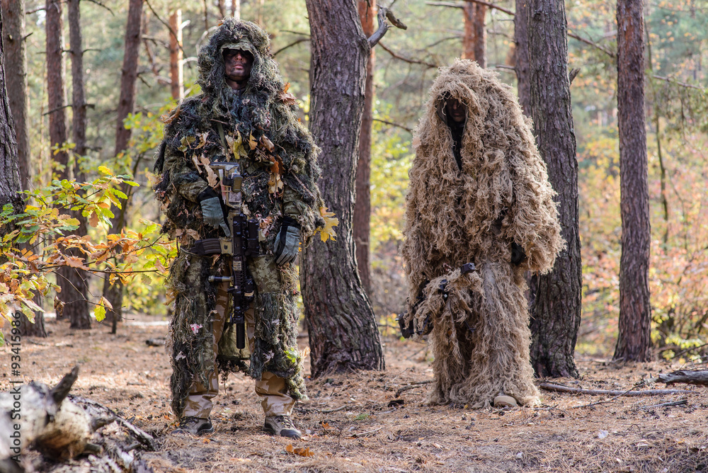 Two snipers in the forest/Two sniper in camouflage suits stands in the ...