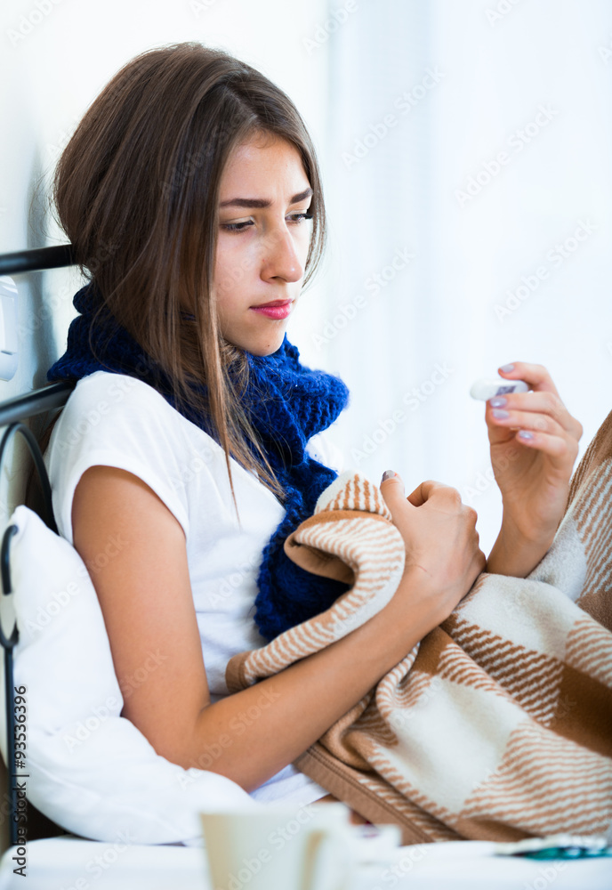 Sick teenage girl with hot tea and medication indoors Stock Photo ...