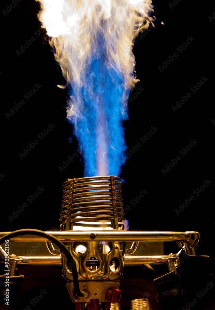 Blue flame shooting out from a balloon gondola's propane burner. Stock ...