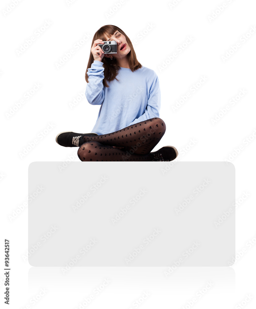 young woman taking a photo sitting on a box isolated on white Stock ...