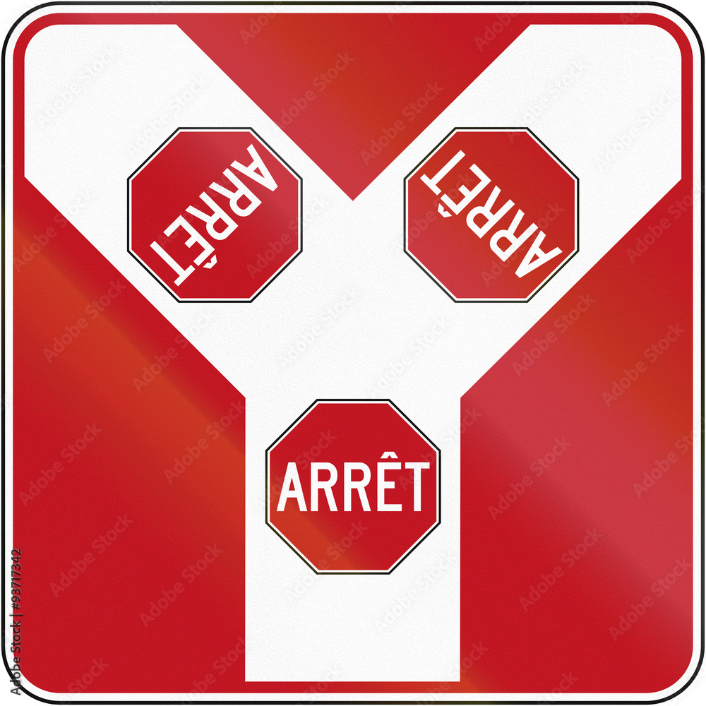 Regulatory road sign in Quebec, Canada - Y intersection with stop signs ...