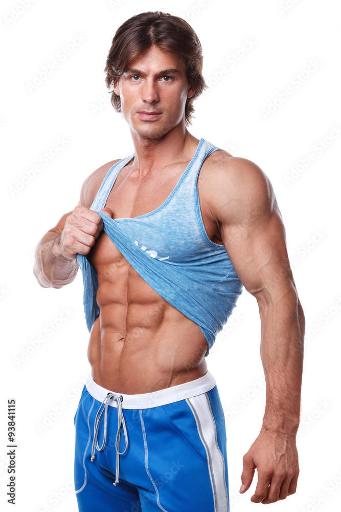 Muscular man taking off his shirt Stock Photo | Adobe Stock