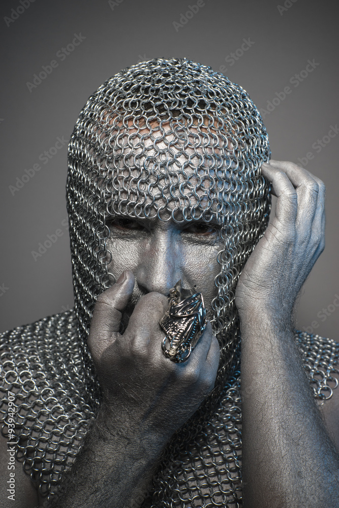 Protection, man in chain mail and leather painted silver, mediev Stock ...