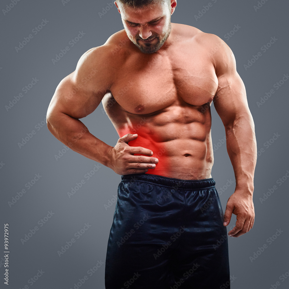 Young sportsman having an acute pain in right side of abdomen ...