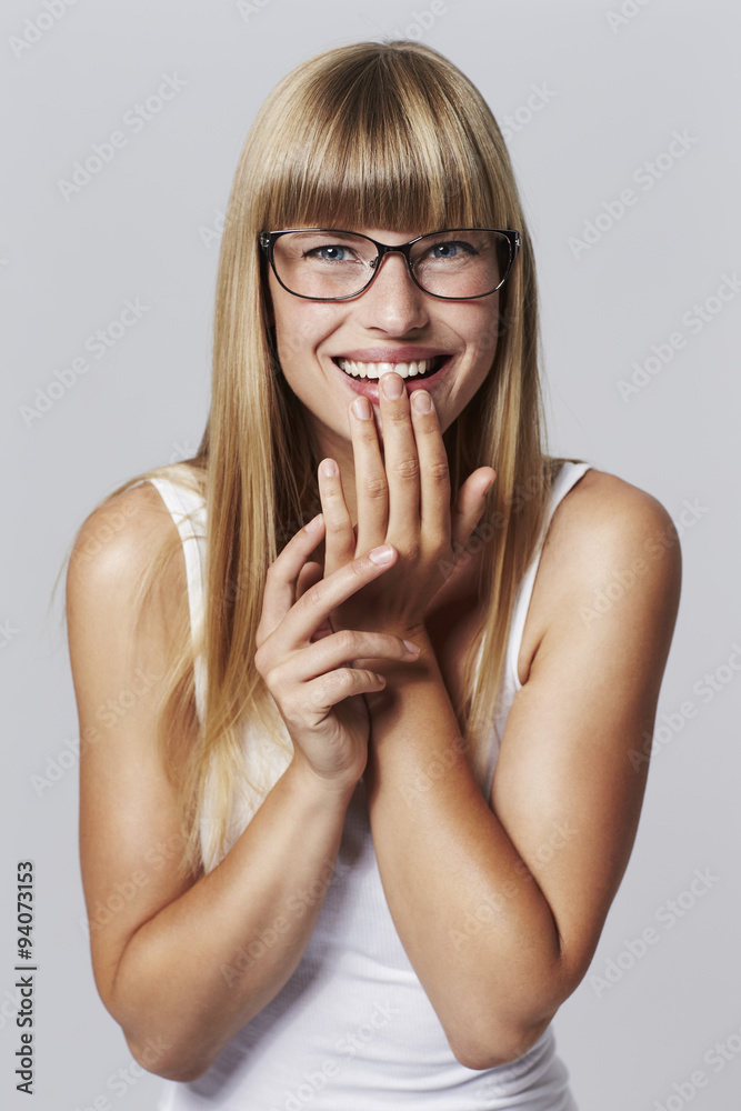 Beautiful woman giggling in glasses, portrait Stock Photo | Adobe Stock