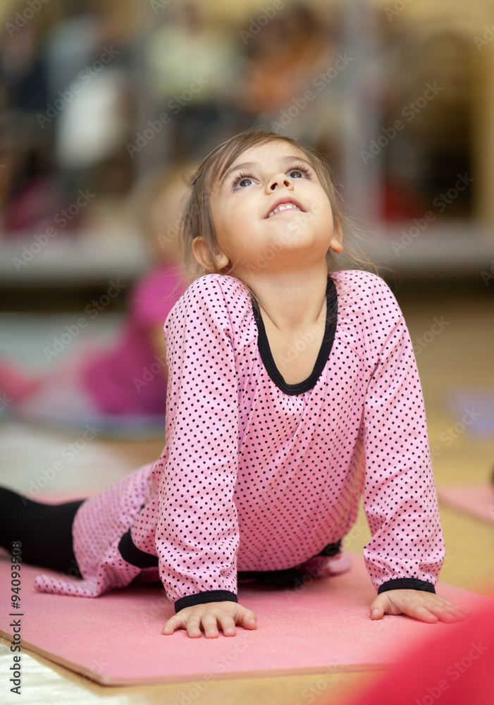 Little girl stretching Stock Photo | Adobe Stock
