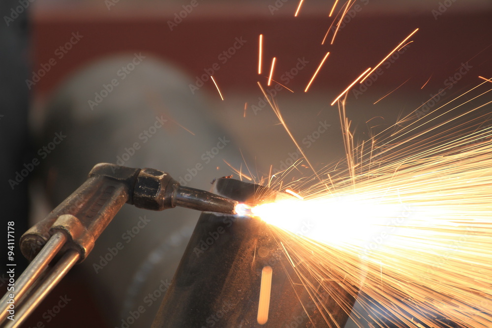 Worker cut pipe by gas cutting Stock Photo | Adobe Stock