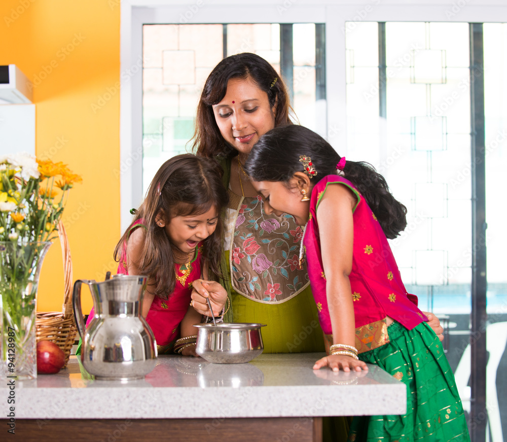indian mother cooking with her daughters at kitchen Stock Photo | Adobe ...