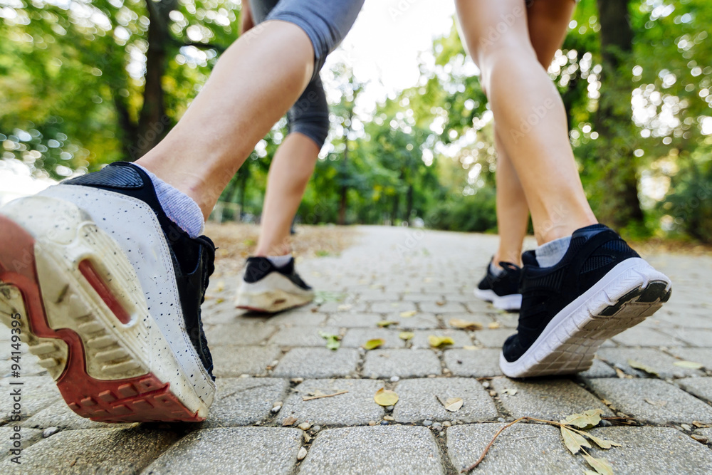 Closeup of female feet while jogging Stock Photo | Adobe Stock