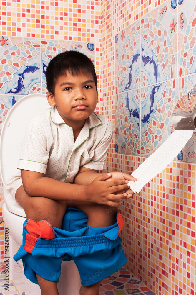 little asian boy defecate in toilet background Stock Photo | Adobe Stock